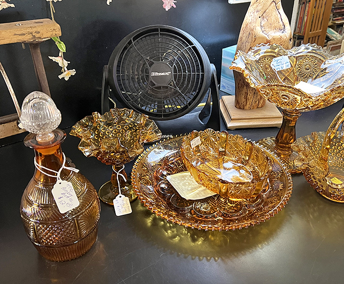 Amber Depression glass catches the light like liquid honey. These pieces survived the Great Depression and now wait for someone to give them a second life.