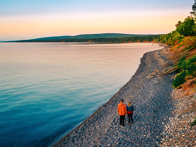 Lake Superior's shoreline offers a moment of tranquility, where the vastness of the water meets the intimacy of a quiet evening stroll.