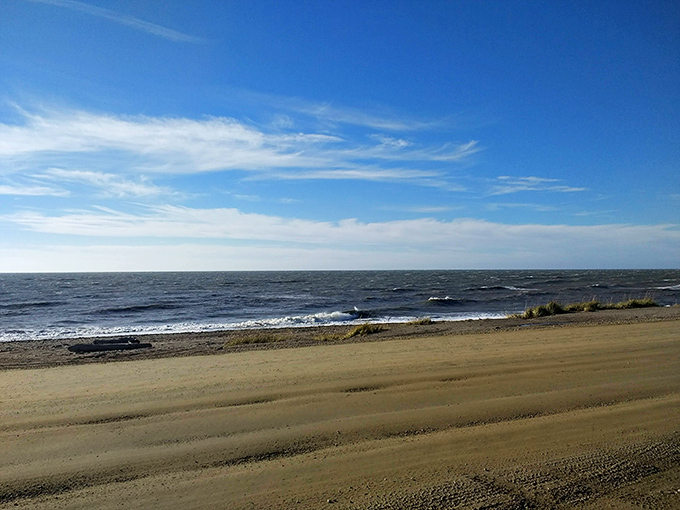 The Bering Sea meets Nome's golden shores, where modern-day prospectors still pan for treasure under the midnight sun.