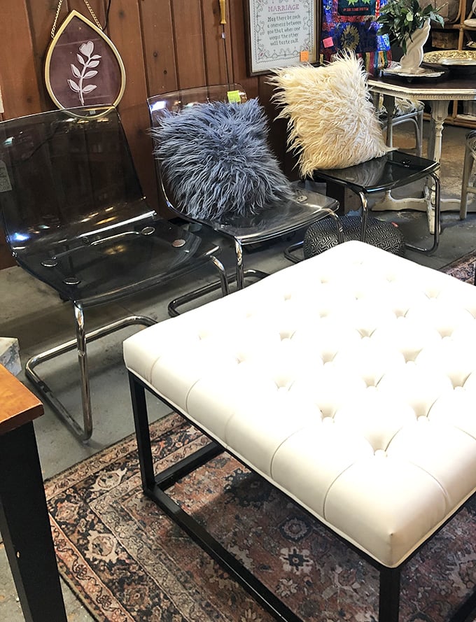 Mid-century meets modern in this seating vignette. Those fuzzy pillows have "touch me" written all over them.