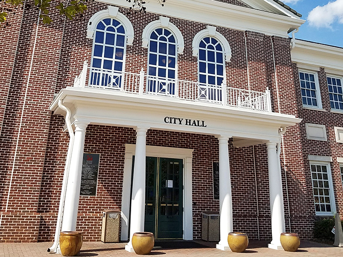 City Hall's dignified brick facade and pristine white columns make even paying a parking ticket feel like participating in democracy at its most architecturally pleasing.