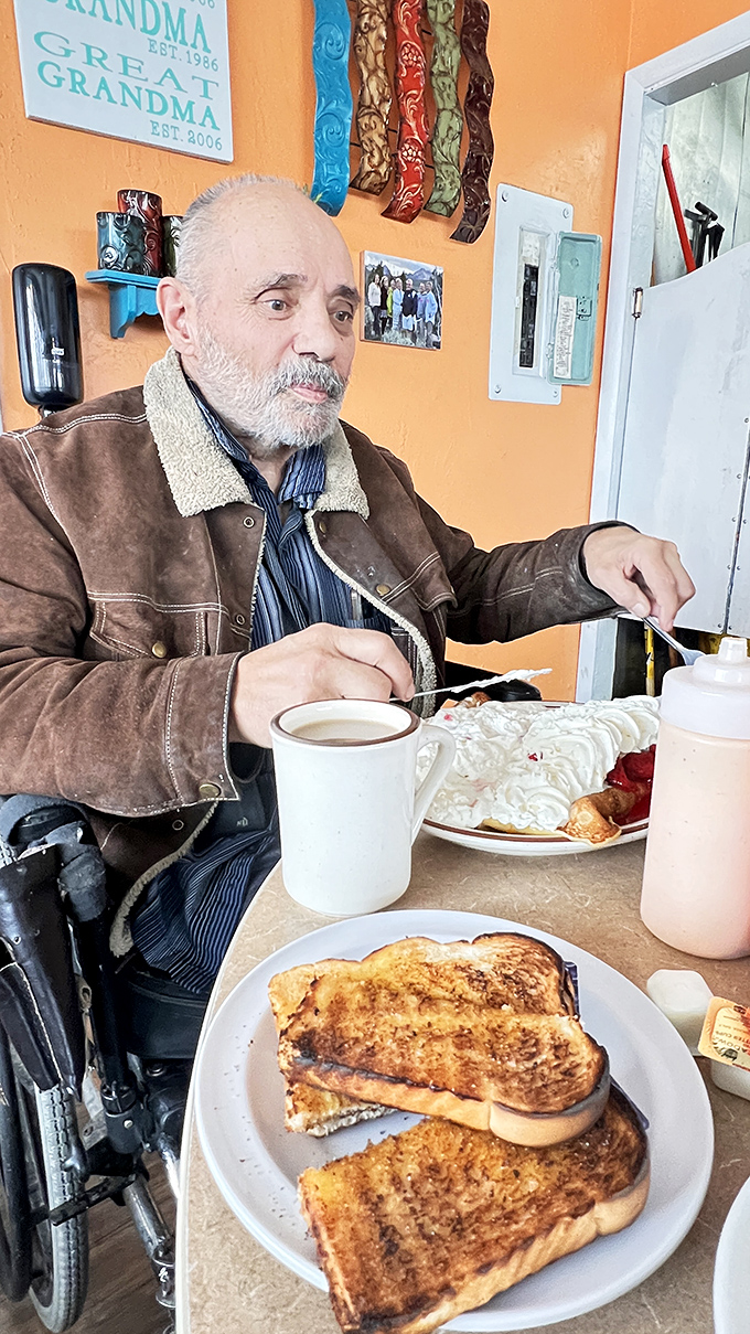 A regular enjoys his breakfast, proving that Norm's isn't just about food &ndash; it's about community. The grilled cheese looks perfectly golden too.