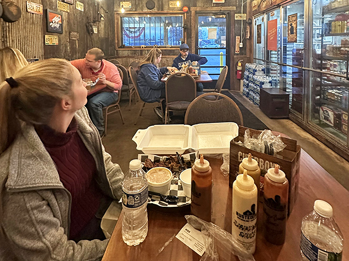 The universal language of barbecue brings strangers together at neighboring tables, united by the silent nod that says "worth every mile driven."