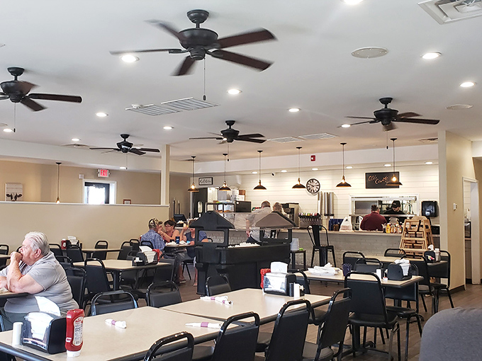 The dining area buzzes with conversation and ceiling fans, creating that perfect diner symphony of comfort and community.