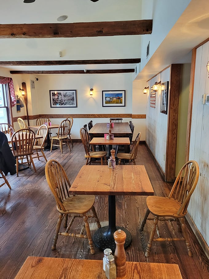 The dining room's warm wood tones and nautical touches create an atmosphere where conversations flow as easily as the wine with your seafood feast.