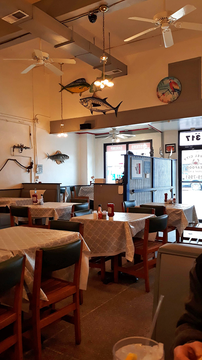 Fish sculptures swim overhead as diners below dive into plates of oceanic treasures. The decor says "we're serious about seafood."