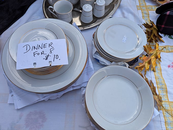 "Dinner for 8&mdash;$10" reads the handwritten promise. These gold-rimmed plates once witnessed family celebrations and now await your holiday table's second act.