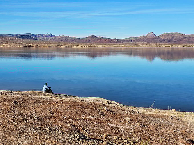 Contemplation comes easier when perched at the edge of stillness, where water mirrors mountains and thoughts finally slow down.
