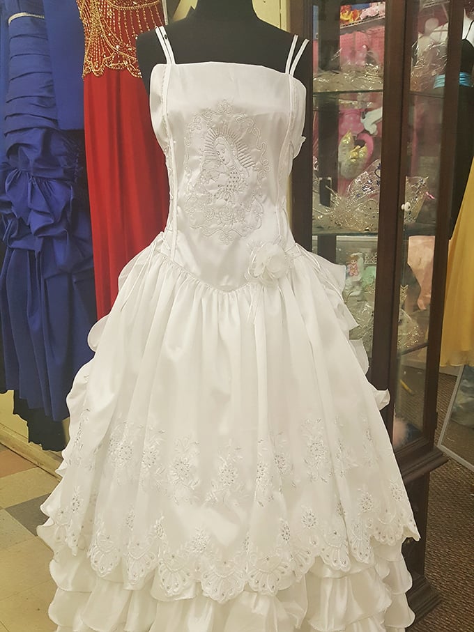 Wedding gowns with previous lives hang hopefully, waiting for second chances at happily-ever-after. Something borrowed, something new-to-you.