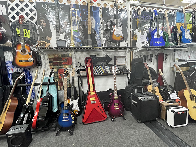 A guitar lover's dream corner where vintage axes and modern six-strings hang together like old friends at a reunion concert.