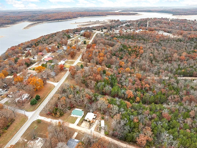 Diamond City from above during fall&mdash;where every winding road leads to another postcard moment between the trees and shoreline.