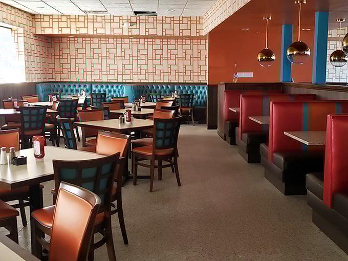 Teal booths and coral chairs create that perfect retro vibe&mdash;where conversations flow as freely as the coffee.