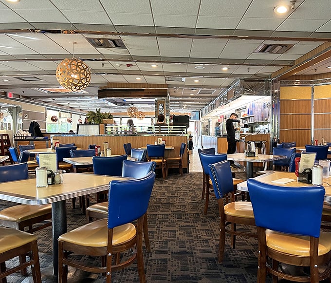 The spacious dining room invites lingering conversations, with those signature blue booths offering the perfect balance of comfort and support&mdash;like therapy, but with pancakes.