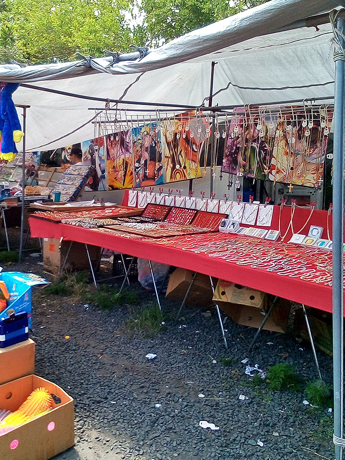 Jewelry display that sparkles with possibility. This red-topped table offers enough bling to make Mr. T consider adding to his collection.