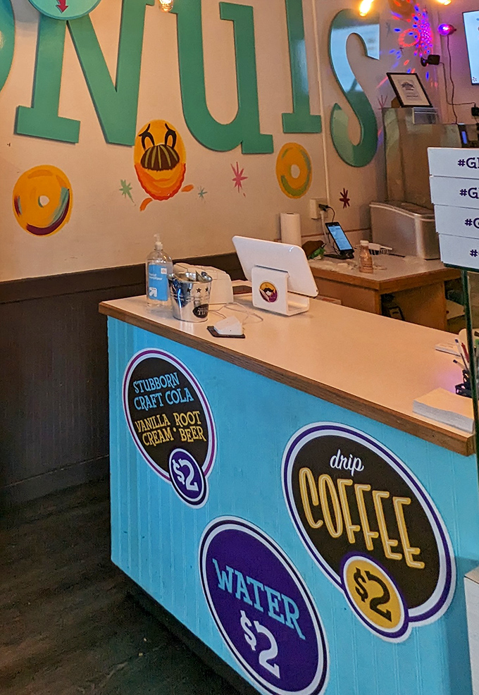 The counter's bright blue paneling and retro signage create a space that feels like stepping into a cartoon world where calories don't count.