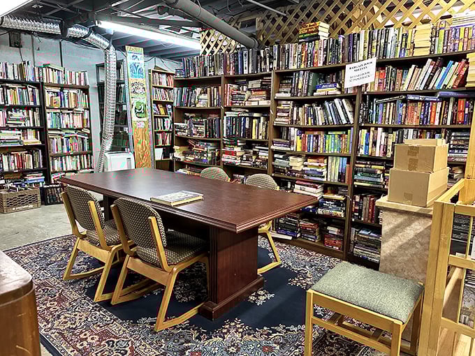 Oriental rugs, wooden chairs, and books to the ceiling &ndash; this reading nook feels like it belongs in an English country estate.