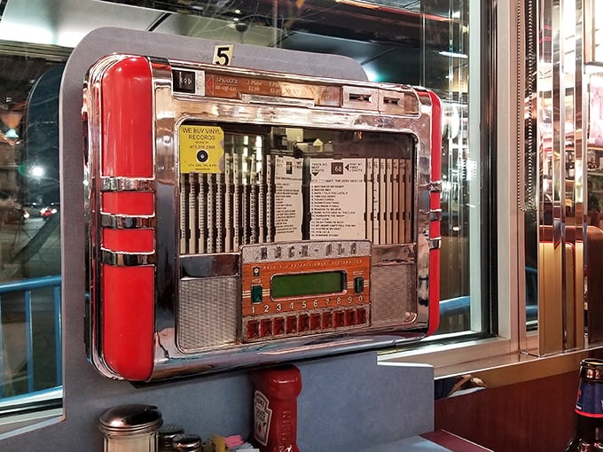 The tabletop jukebox: where three quarters still buys you a three-minute vacation to anywhere in musical history. Pure nostalgic magic!