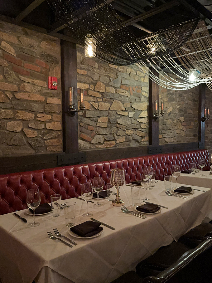 Red leather banquettes, stone walls, and twinkling lights overhead &ndash; the dining room equivalent of a warm, sophisticated hug.