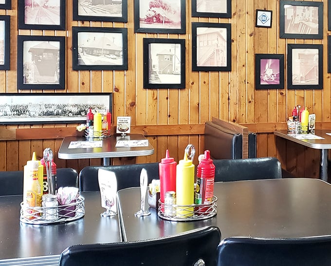 Every table tells a story at Nick's, where the condiment caddy is always within reach and the wood-paneled walls display Huntington's history like a community scrapbook.