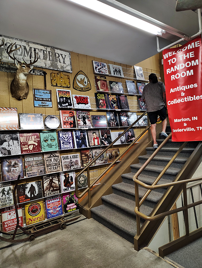 The stairway to antiquing heaven, lined with enough nostalgic metal signs to decorate every man cave in Tennessee. Follow the arrows to more treasures.