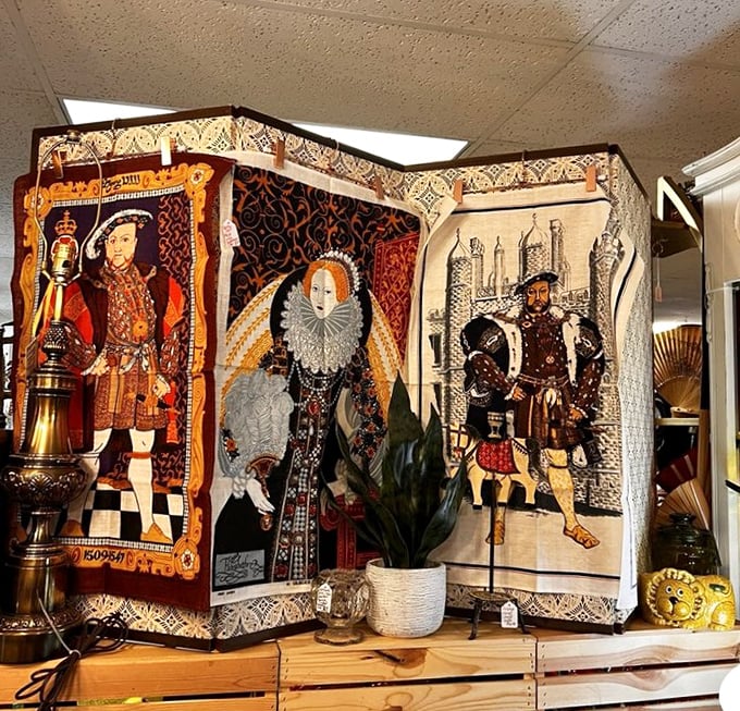 Royal figures from history watch over the shop from these tapestries, silently judging your fashion choices compared to their elaborate finery.