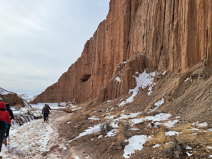 Winter transforms Cathedral Gorge into a whole new experience, where snow creates a striking contrast against the rusty canyon walls.