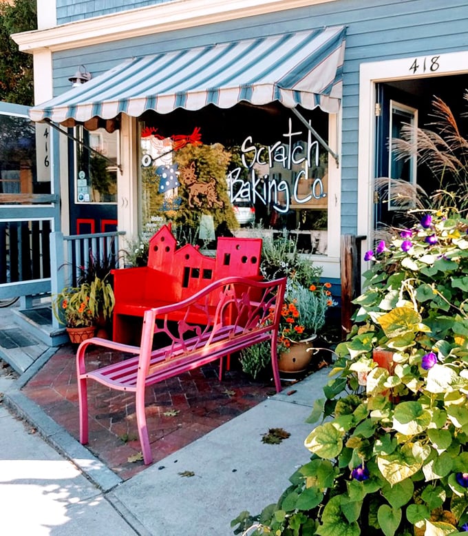 That striped awning and those red benches aren't just cute—they're strategic resting spots for the inevitable line of bagel pilgrims on weekend mornings.