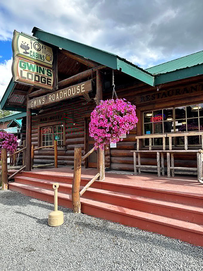 Bright pink petunias and sturdy log construction create that perfect Alaska lodge welcome you've been dreaming about.
