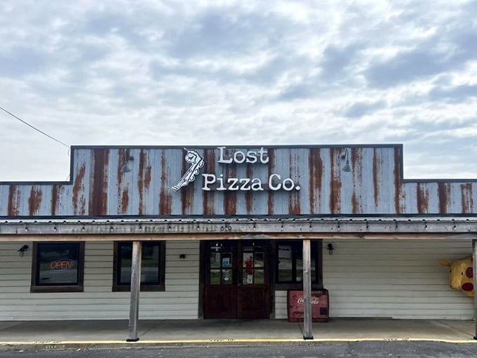 Lost Pizza Co's rustic metal sign has weathered many seasons, but their pizza recipe remains timeless.