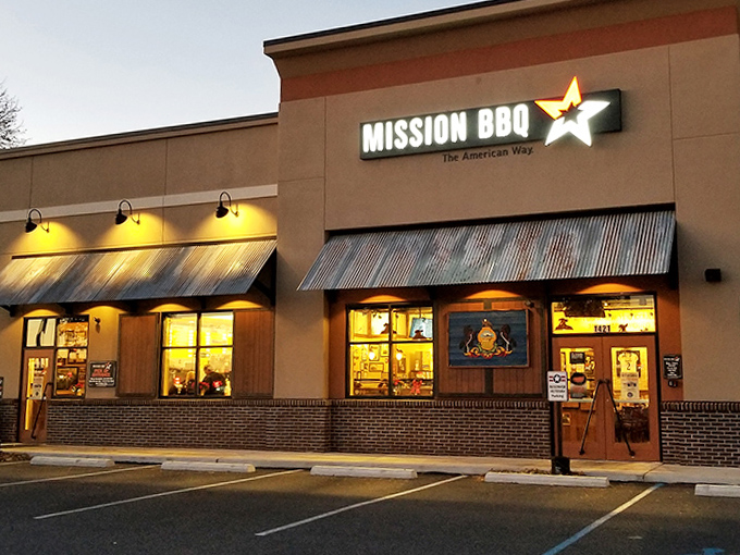 Mission BBQ's warm glow at dusk feels like a beacon for the BBQ-deprived. The corrugated metal awning adds that touch of roadside authenticity.