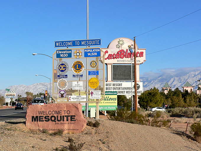 Mesquite welcomes you with a sign that's practically a small town itself. The desert mountains stand guard over this oasis of affordability.