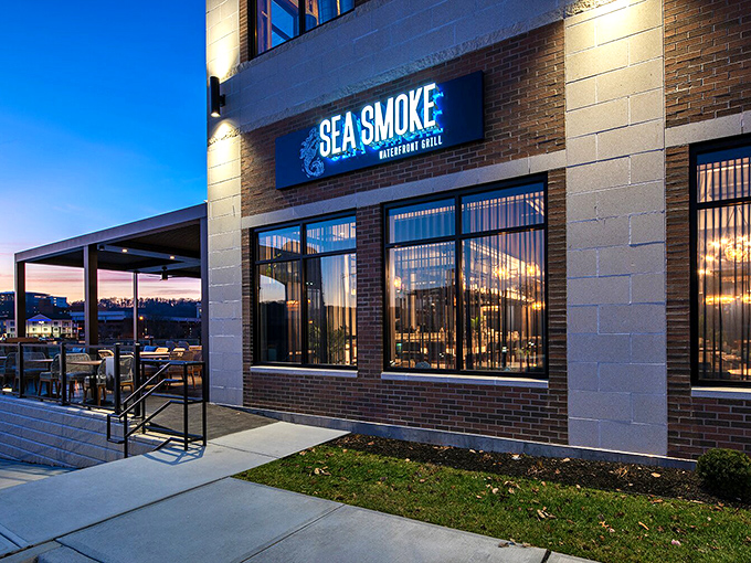 Modern waterfront dining meets timeless seafood traditions in this sleek riverside culinary destination.