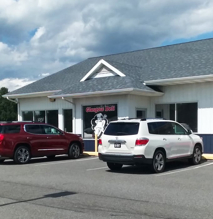 The white and blue exterior of Glasgow Deli stands ready to serve hungry travelers looking for a taste of Delaware sandwich culture.