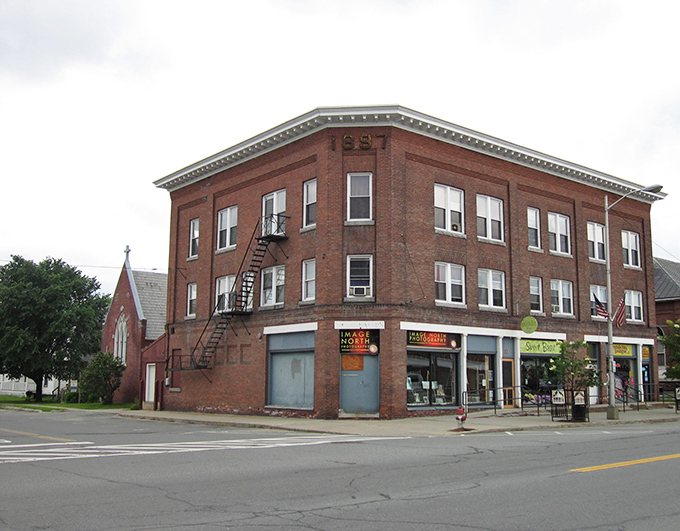 Historic brick buildings anchor Lyndonville's downtown, where local shops still believe in the radical concept of knowing customers by name.