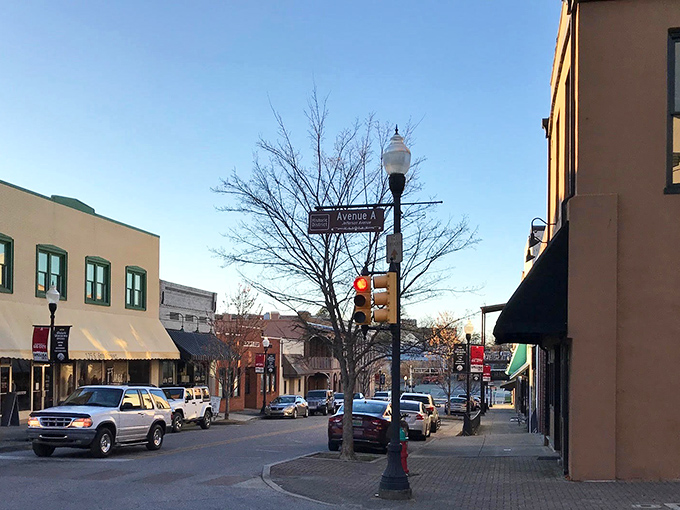 A quiet street corner in downtown Opelika invites afternoon strolls and window shopping, just steps away from neighborhoods where $300K still buys impressive square footage.