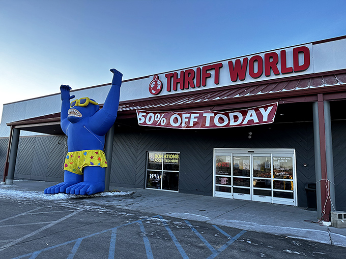 That giant blue inflatable mascot is practically saying, "Come on in! The savings are enormous!" Subtle? No. Effective? Absolutely!