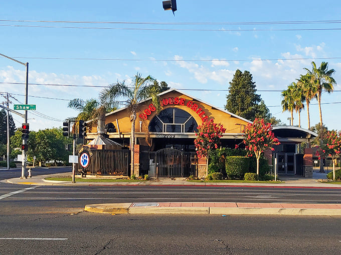Bathed in golden California sunshine, Dog House Grill's inviting exterior promises tri-tip treasures within. Those palm trees aren't just for show&mdash;they're nature's way of pointing to barbecue paradise.