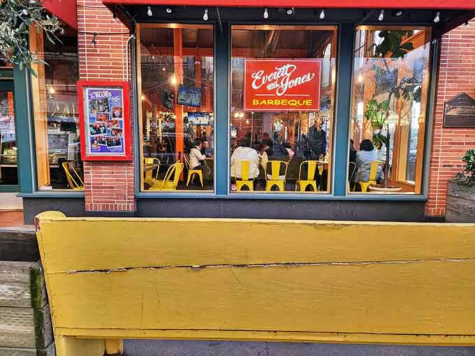 The iconic red sign and yellow chairs at Everett & Jones aren't just decor&mdash;they're a promise of the smoky delights waiting inside this Oakland treasure.