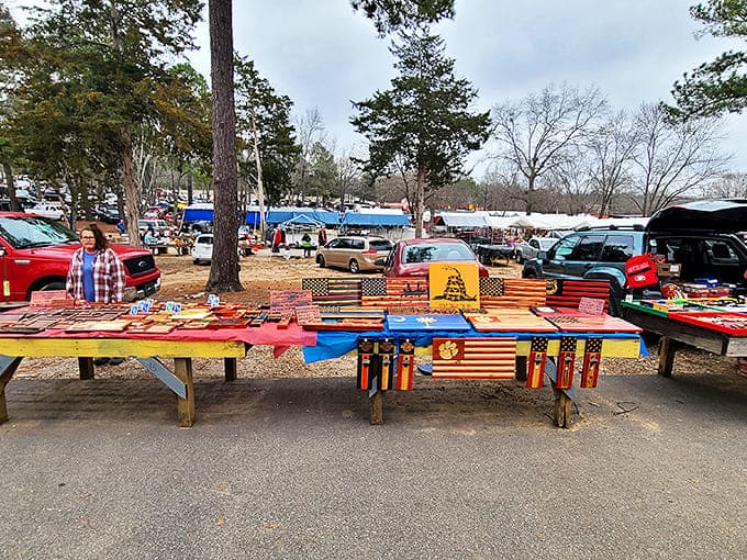 Patriotic wooden flags and handcrafted treasures await bargain hunters at J&J's outdoor section, where cars fill the sprawling lot.