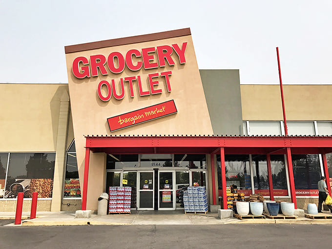 The iconic red and tan facade of Grocery Outlet stands like a beacon of hope for budget-conscious shoppers across Boise.