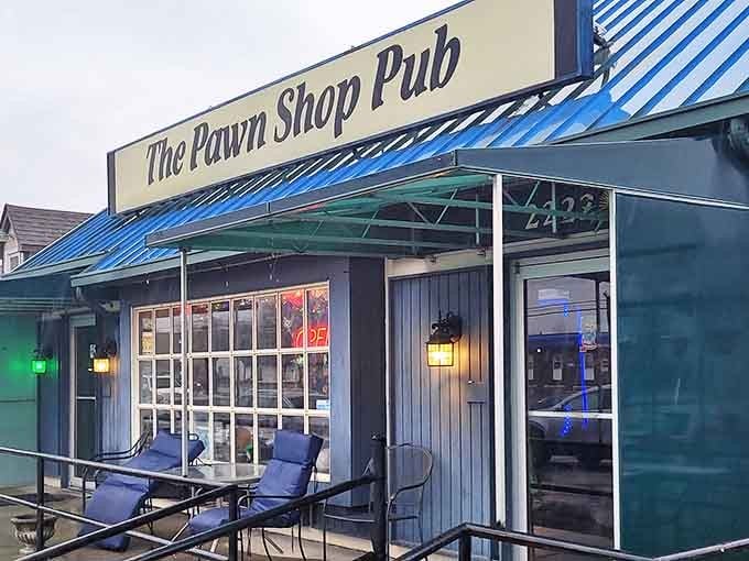 The distinctive blue roof and unassuming exterior of Pawn Shop Pub hide culinary treasures within this Indianapolis neighborhood gem.