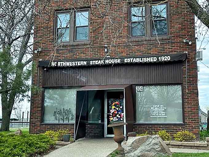 The unassuming brick exterior of Northwestern Steakhouse stands like a culinary lighthouse in Mason City, beckoning meat lovers from miles around.