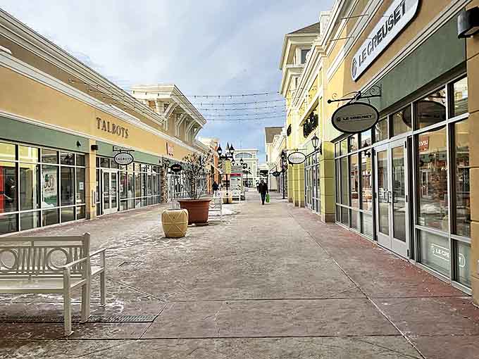 Strolling through these pristine walkways feels like you've discovered a secret European village—except this one specializes in discount designer goods.