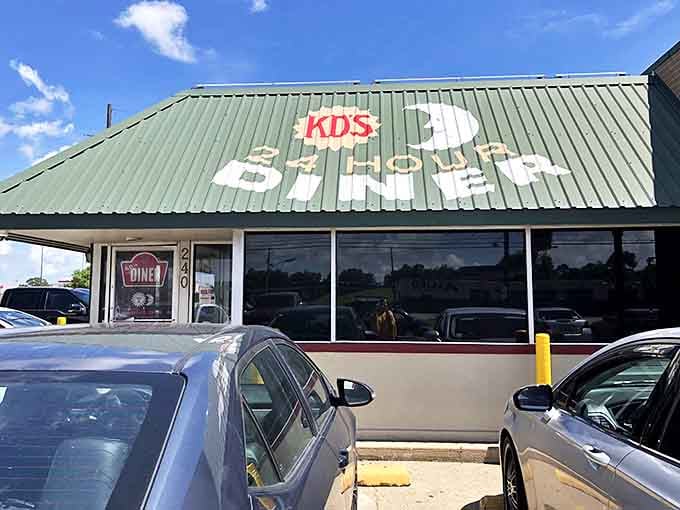 The green-roofed beacon of breakfast hope stands proudly on the Lake Charles landscape, promising 24-hour comfort in neon-lit glory.
