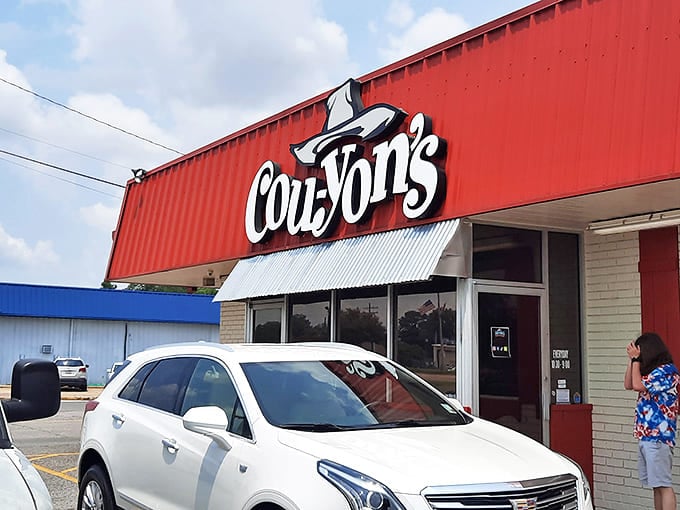 That iconic red exterior isn't just a building&mdash;it's a beacon of barbecue hope standing proudly against the Louisiana sky.