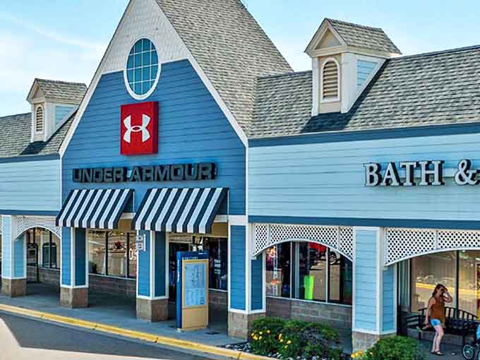 Under Armour's bold red signage stands out against the New England-inspired architecture, promising athletic gear that performs better than your workout excuses.