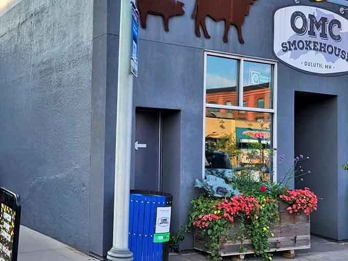 The unassuming gray exterior with metal cattle silhouettes is like a smoke signal to BBQ lovers &ndash; understated but promising delicious secrets within.