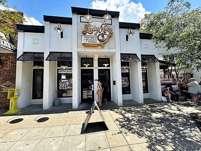 Lady May&rsquo;s illuminated storefront welcomes early visitors like a beacon, inviting hungry souls to enjoy coastal charm blended with urban style in Ocean Springs.