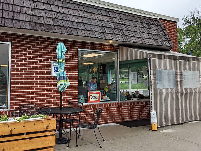 The humble brick exterior of Harold's Koffee House hides culinary treasures within. That outdoor seating isn't just furniture&mdash;it's where breakfast dreams come true.