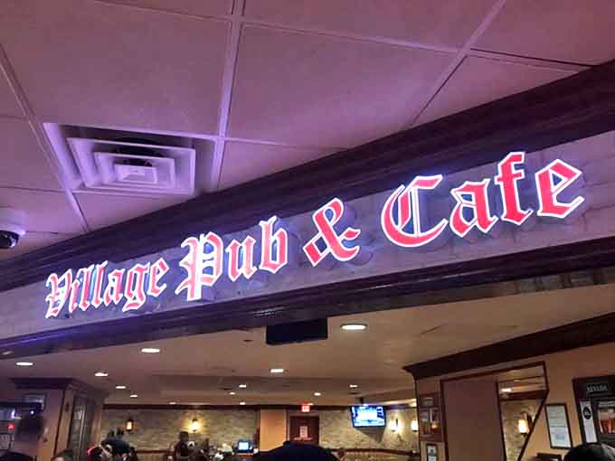 The iconic red sign welcomes you like an old friend. Village Pub & Cafe promises comfort without pretension &ndash; exactly what you need after a day of Vegas chaos.